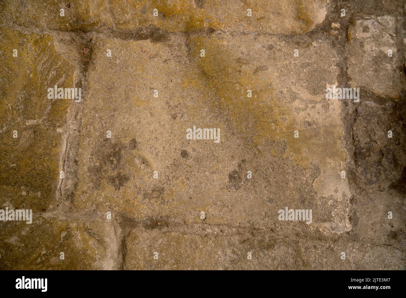 Close up of worn smoothed stone floor of an ancient Roman road or ...