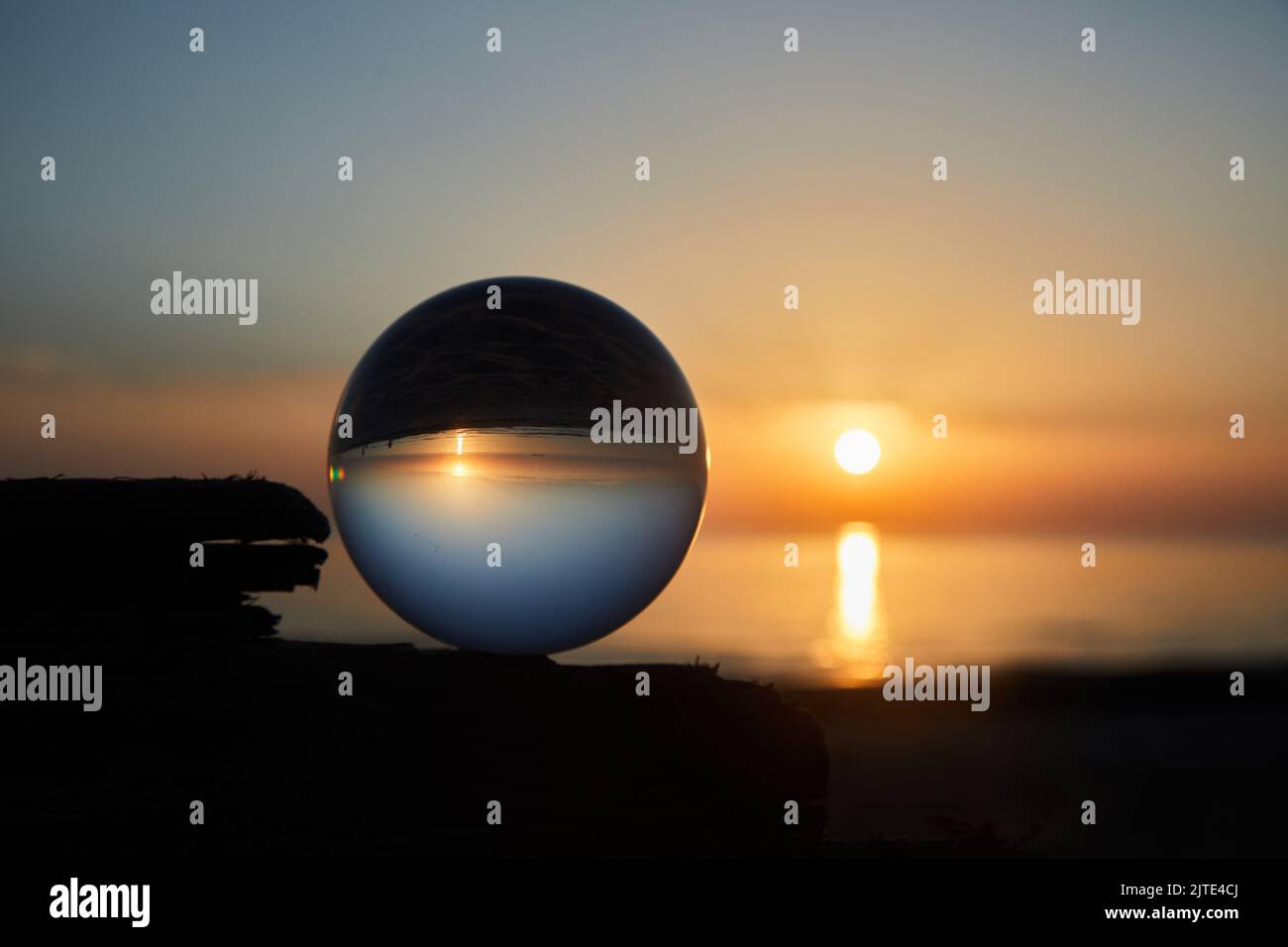 Sunset over ocean through hi-res stock photography and images - Alamy