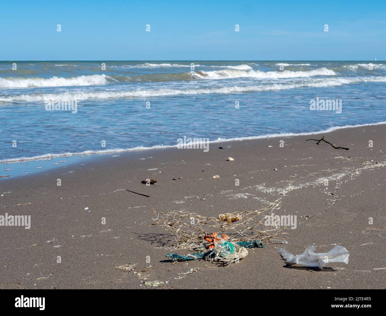 Plastic garbage on a beach Environmental pollution Stock Photo - Alamy