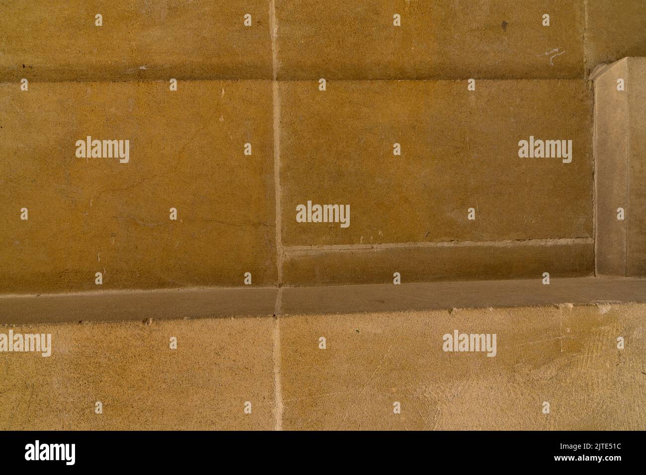 Close up of historical plane sandstone wall facade with rectangular ...