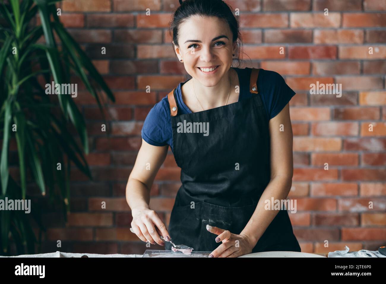 artist studio clay handicraft workplace woman tool Stock Photo - Alamy
