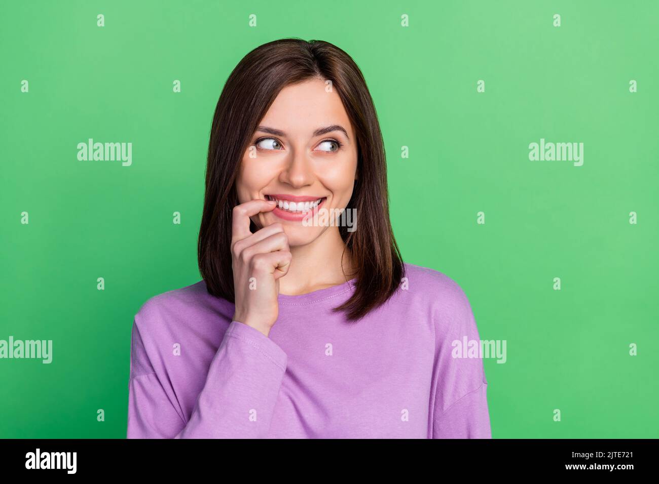 Closeup photo of young perfect lady looking empty space bite finger ...