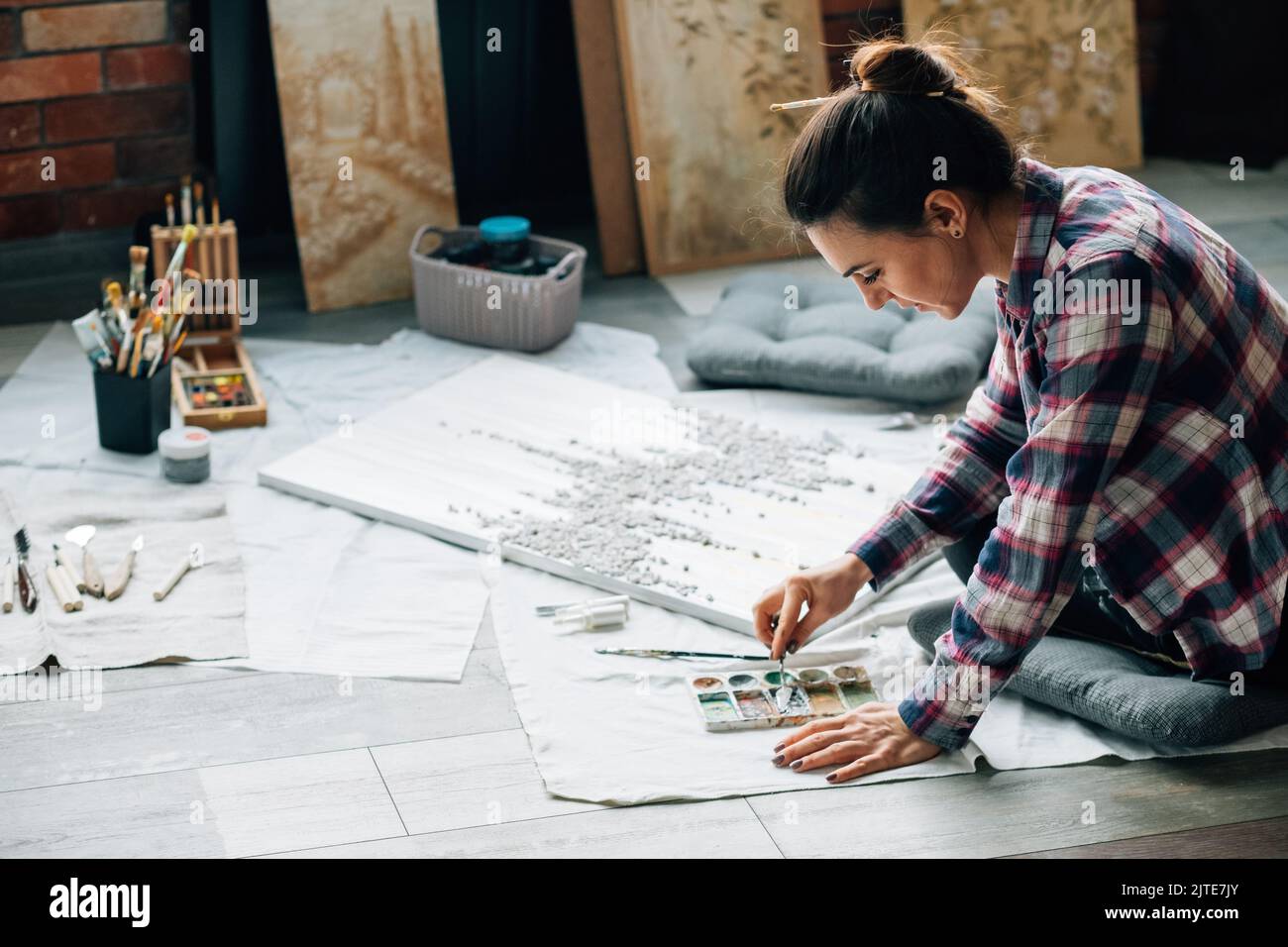 artist painting canvas studio workplace artworks Stock Photo - Alamy