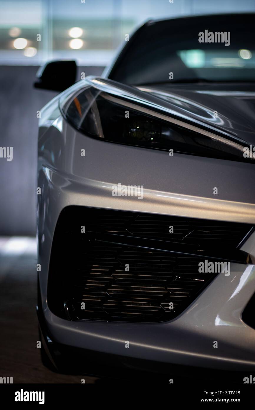 A vertical closeup of a white modern car headlights Stock Photo - Alamy