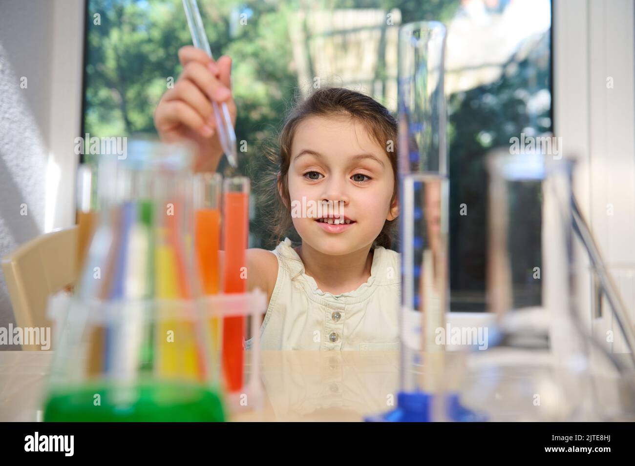 Inspired schoolgirl using pipette, makes lab experiment on the ...