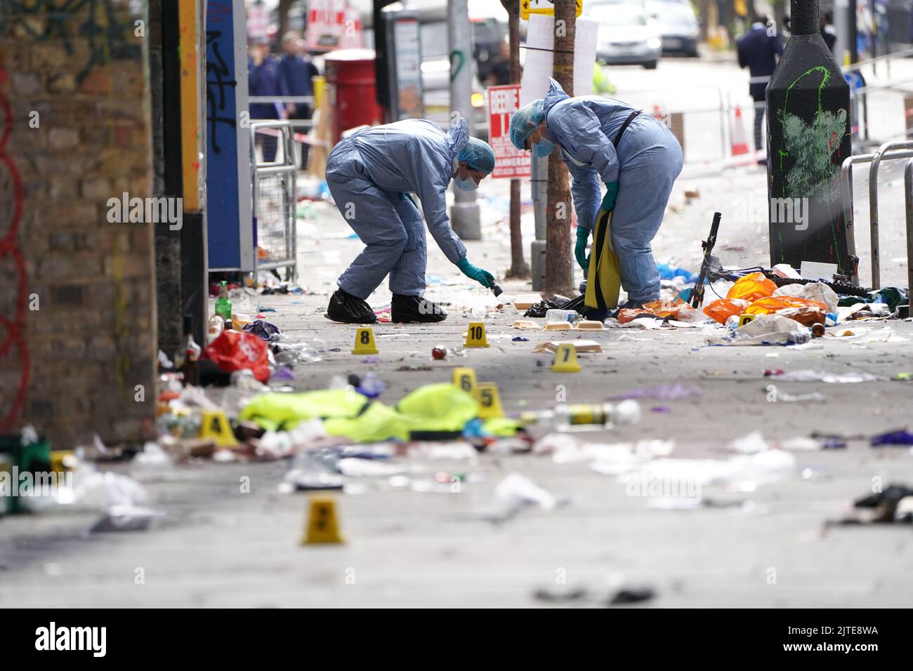 Forensics officers at the scene in Ladbroke Grove, west London, where a ...