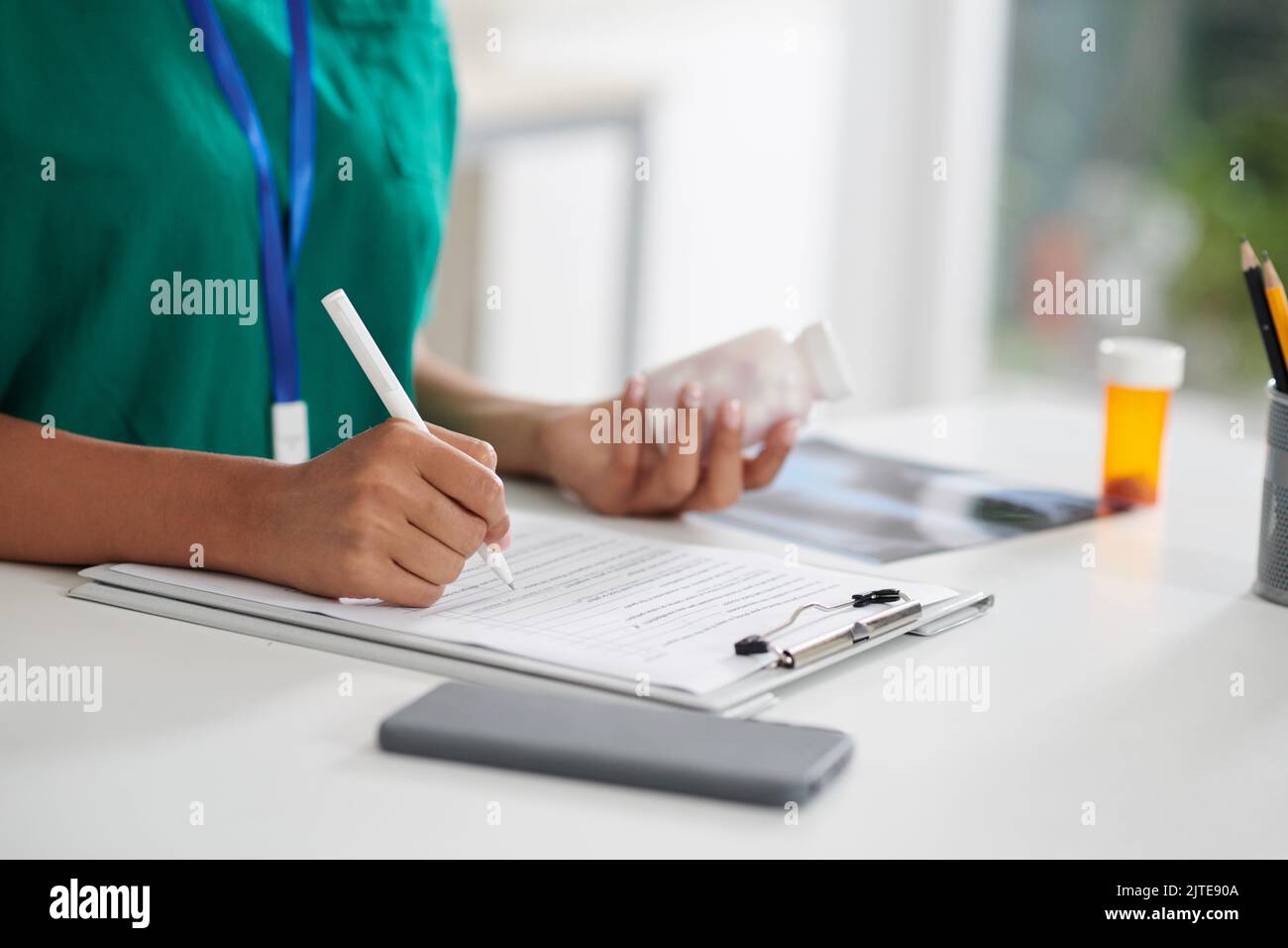 Closeup image of doctor prescribing medicine to patient and writing ...