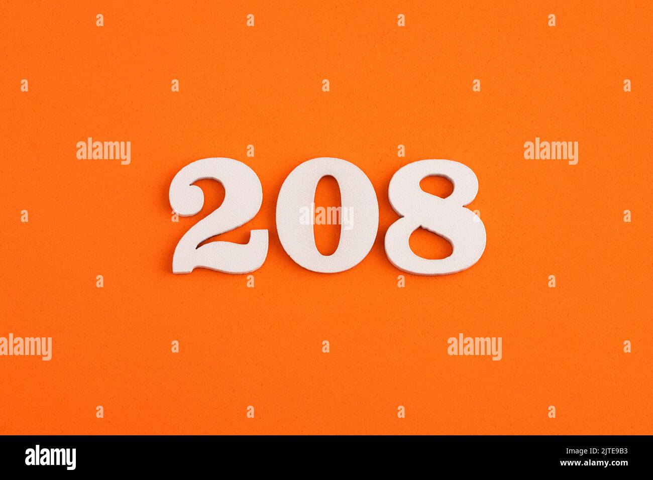 White wooden number 208 on eva rubber orange background Stock Photo - Alamy
