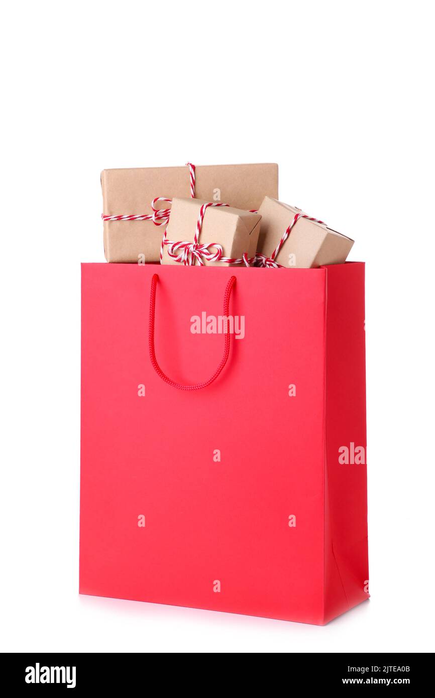 Gift boxes in red shoping bag on white background, shopping concept ...