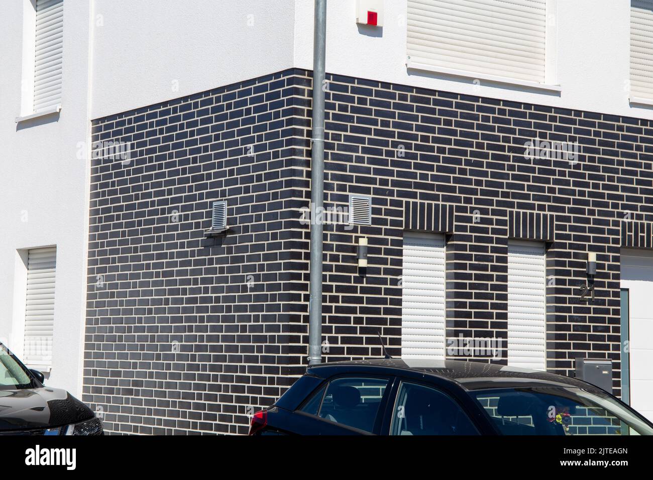 Beautiful residential building facade with partial cladding with ...