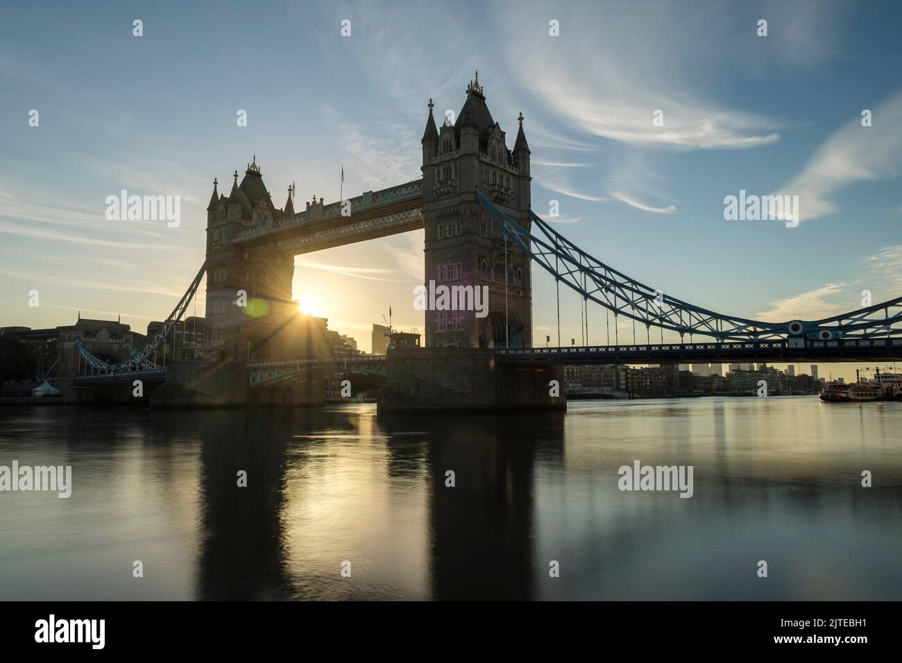 Sun rises behind Tower Bridge London on a beautiful summer morning ...
