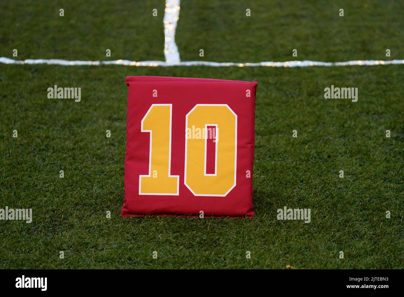 Close-up detail of a yard marker standing on a soccer field. Team sport ...