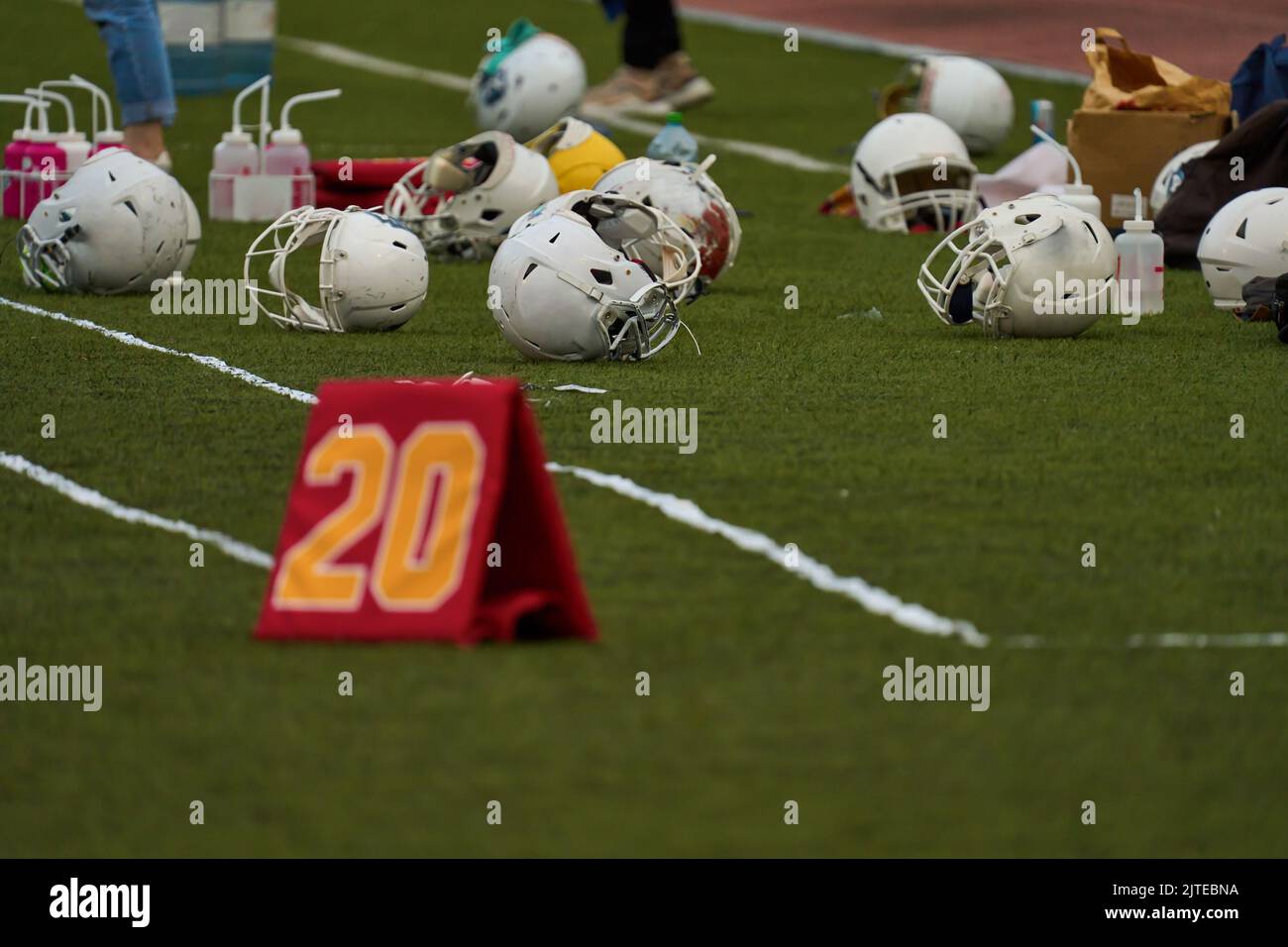Close-up detail of a yard marker standing on a soccer field. Team sport ...