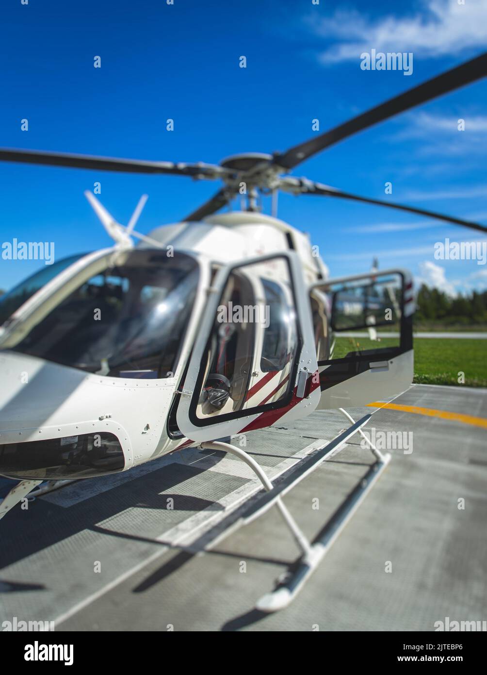 Civil white helicopter getting ready to fly take off, commercial ...