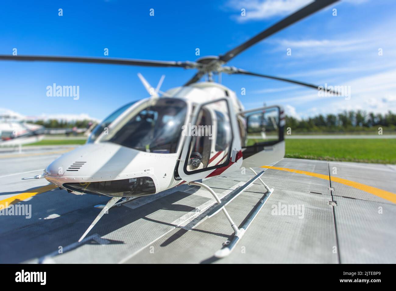 Civil white helicopter getting ready to fly take off, commercial ...