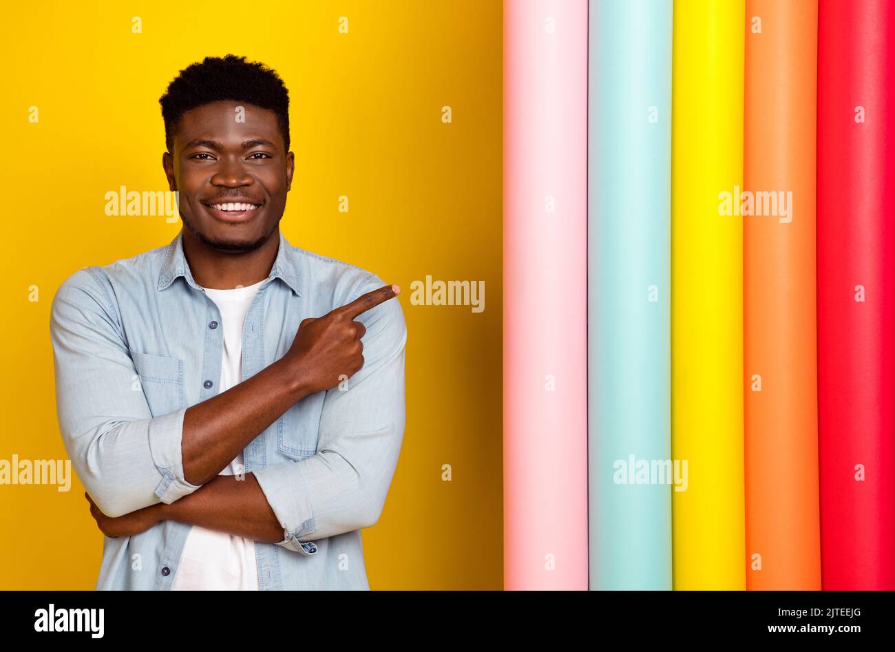 Photo of positive guy build store assistant point wallpaper variety ...