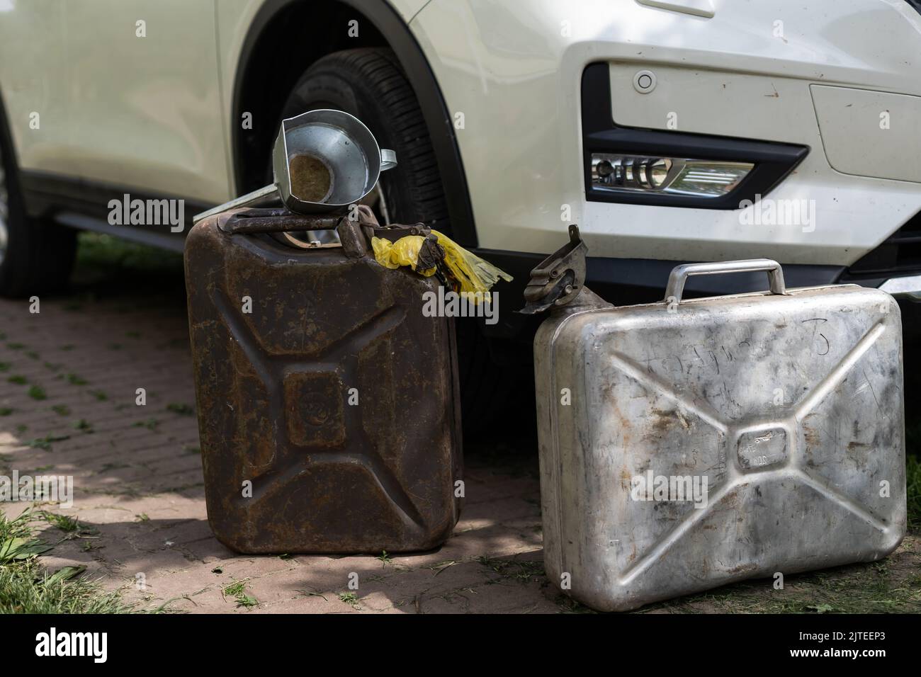 canister and watering can for diesel. the canister with the fuel and ...