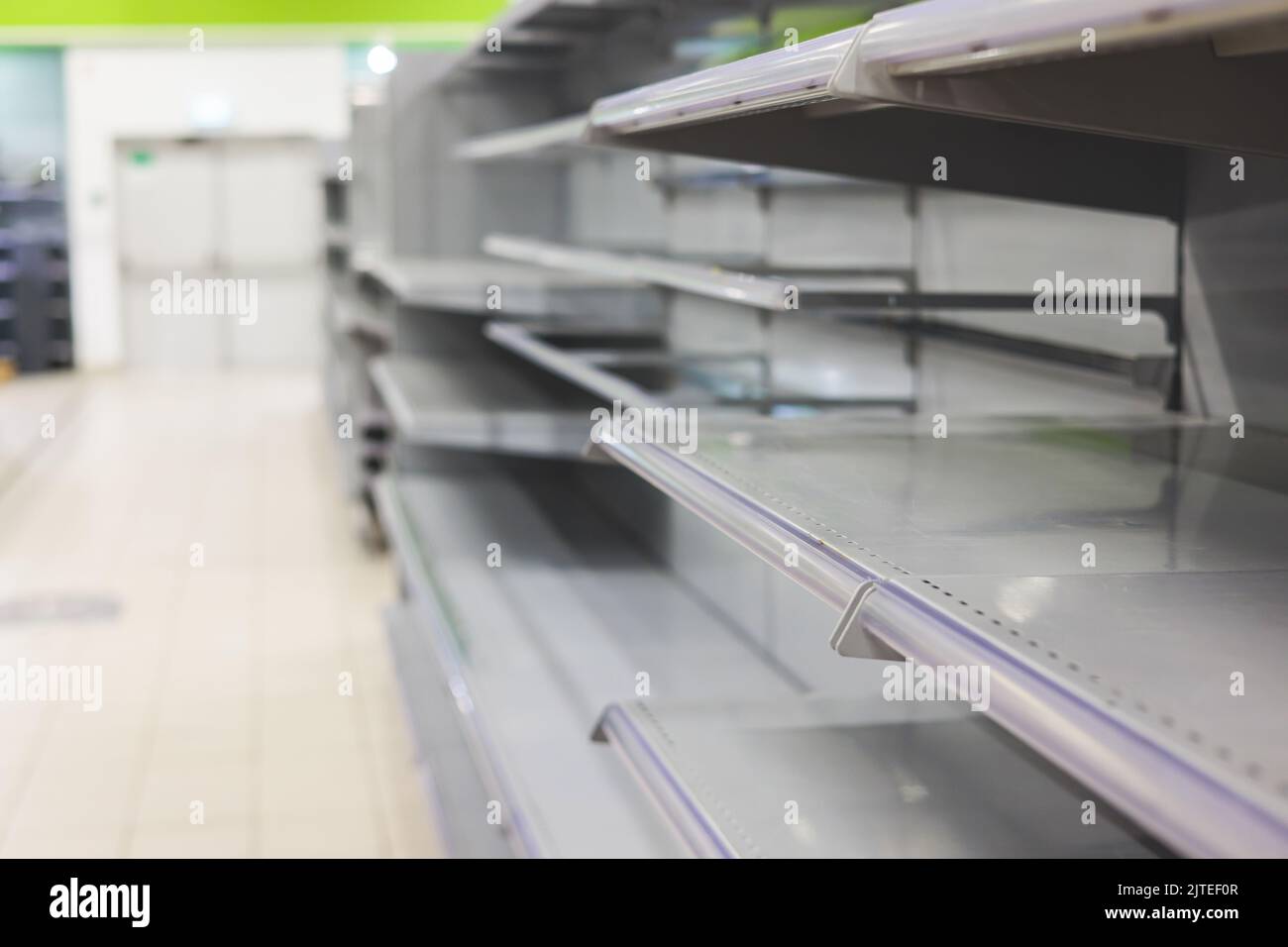 View of empty supermarket shelves, grocery store work stoppage closes ...