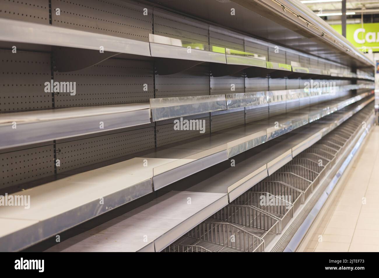 View of empty supermarket shelves, grocery store work stoppage closes ...
