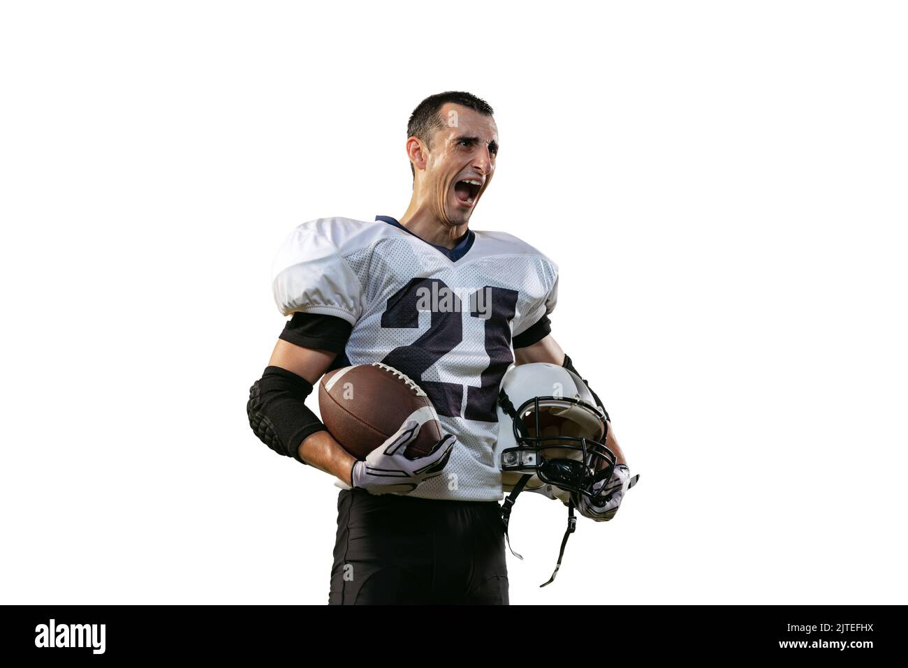Portrait of emotive man, american football player in uniform, holding ...
