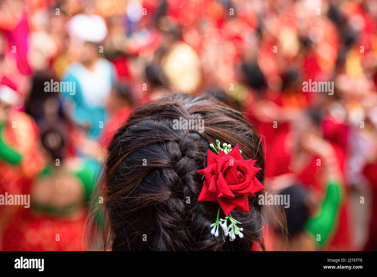A Nepalese Hindu woman seen looking at people celebrating while dressed ...