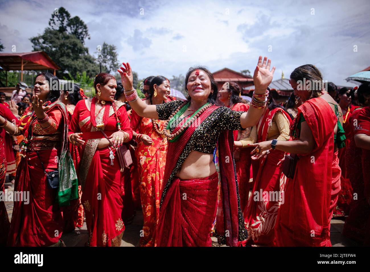 Nepalese Hindu women sing, dance, and celebrate while dressed in ...