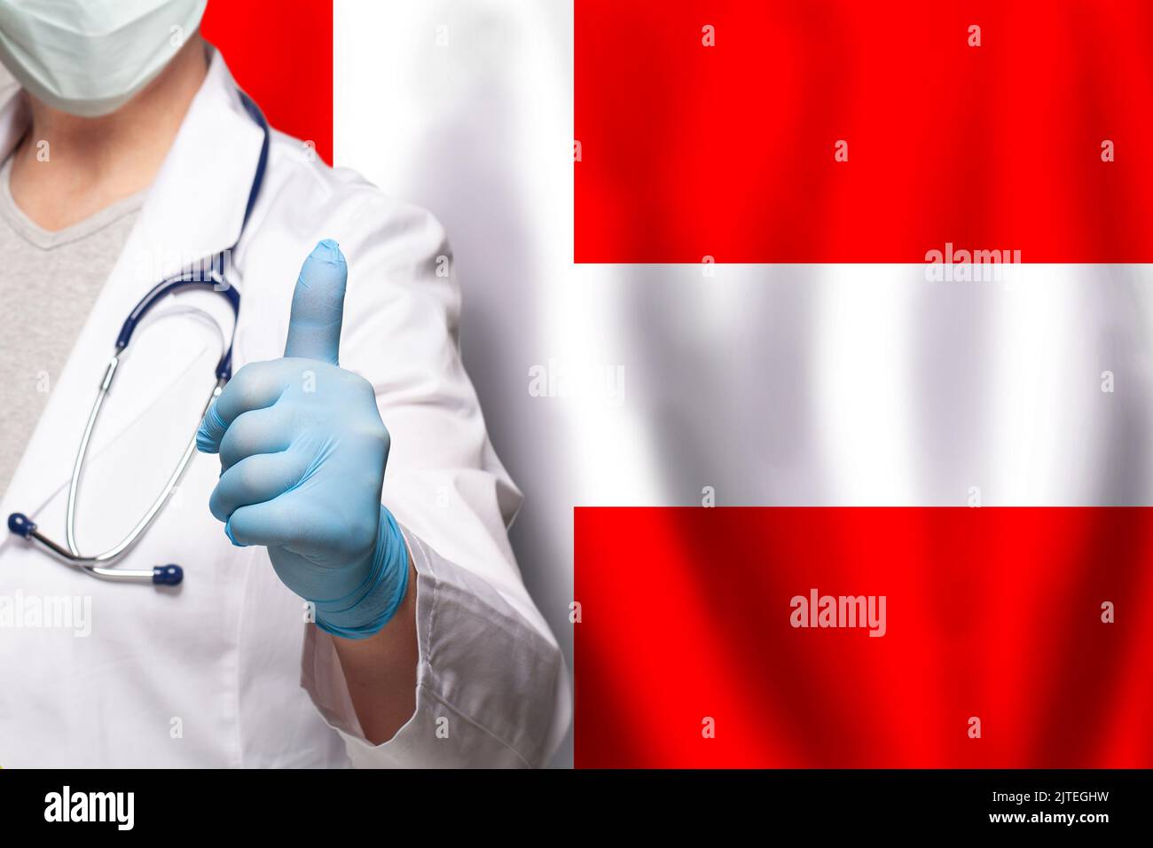 Danish doctor's hand showing thumb up positive gesture on flag of ...