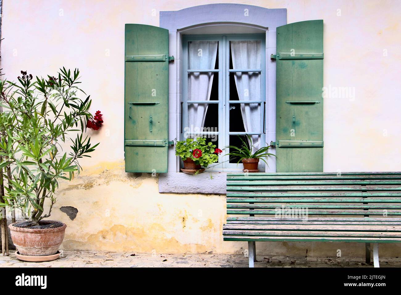 french style windows with green shutters Stock Photo - Alamy