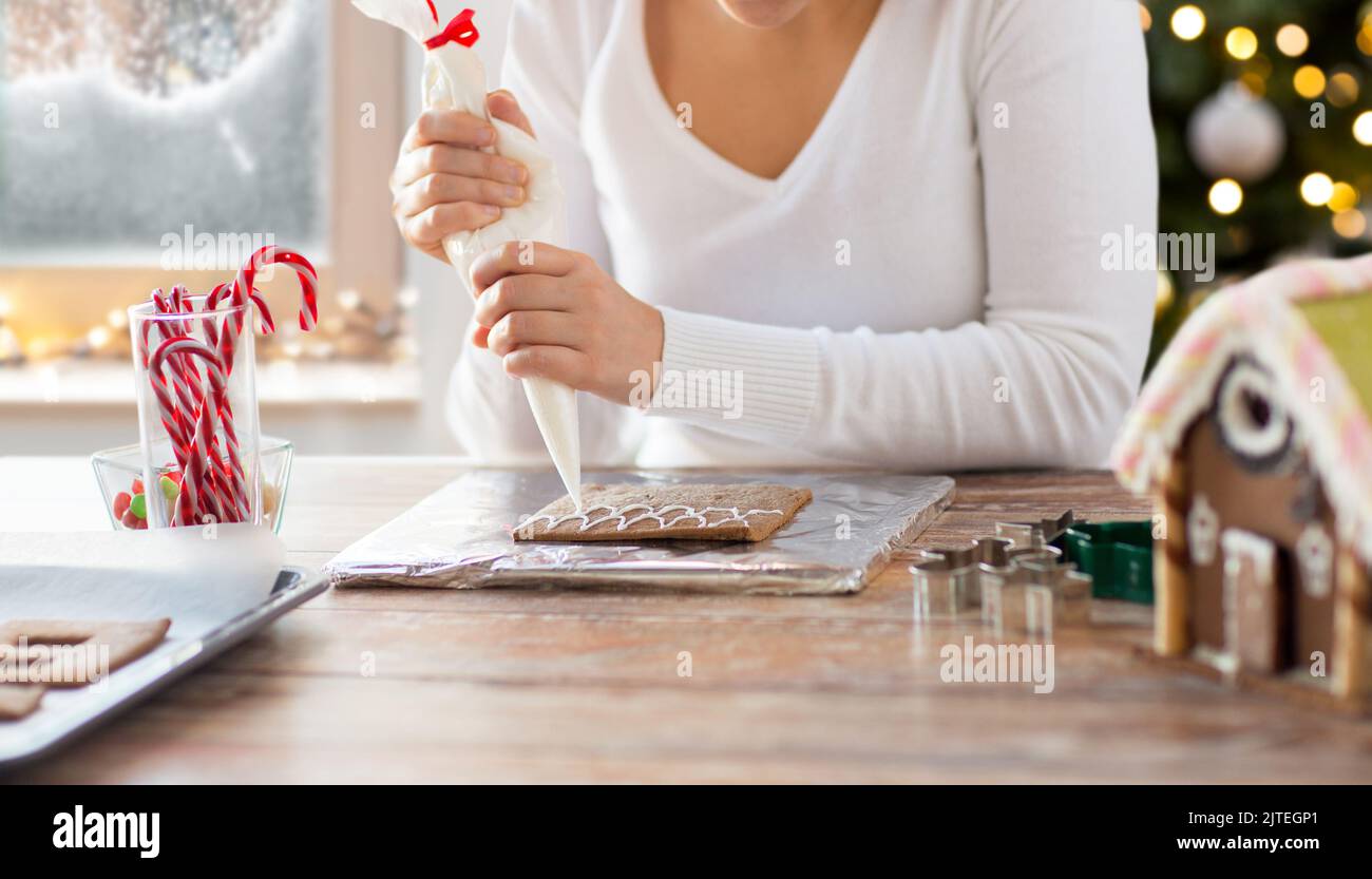 Woman glazing traditional gingerbread hi-res stock photography and ...