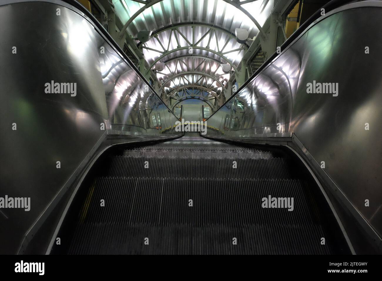 The top view of the escalator under the illumination of the lamps Stock ...