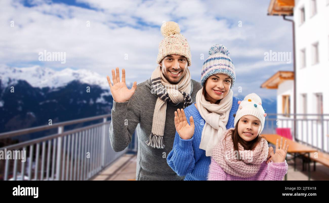 happy family waving hands over mountains in winter Stock Photo - Alamy