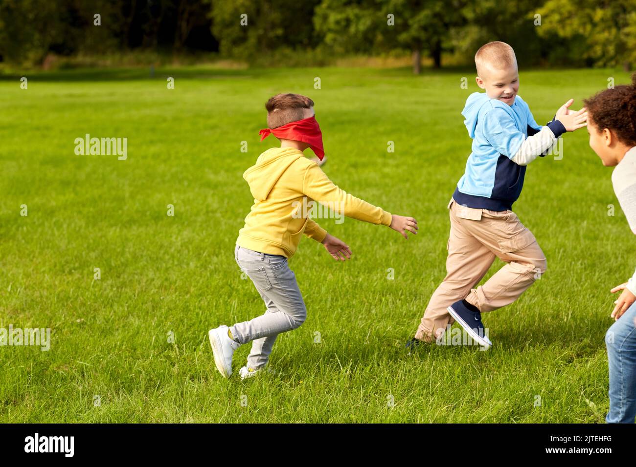 happy children playing and running at park Stock Photo - Alamy