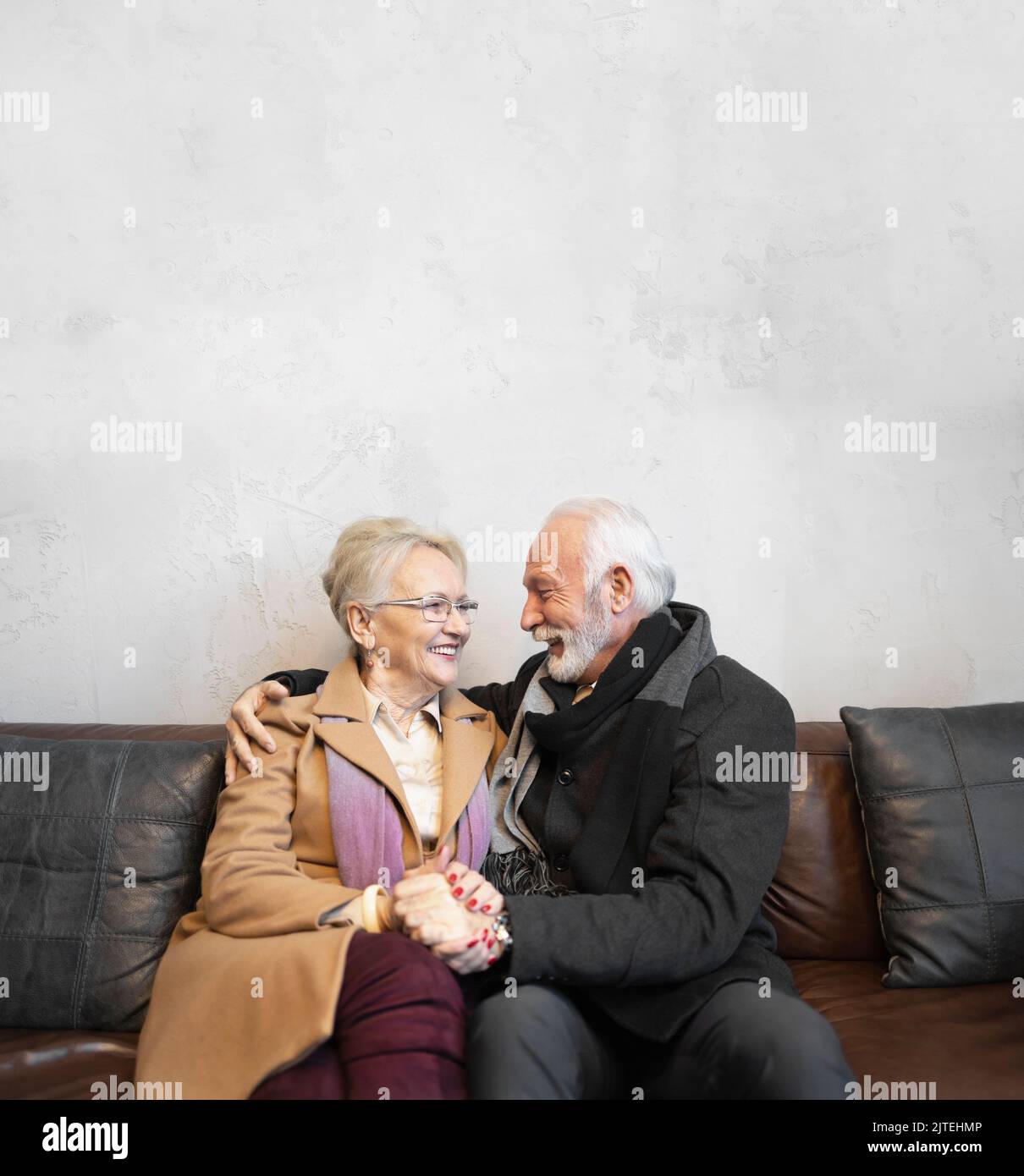 Elderly couple loving and holding each other Stock Photo - Alamy