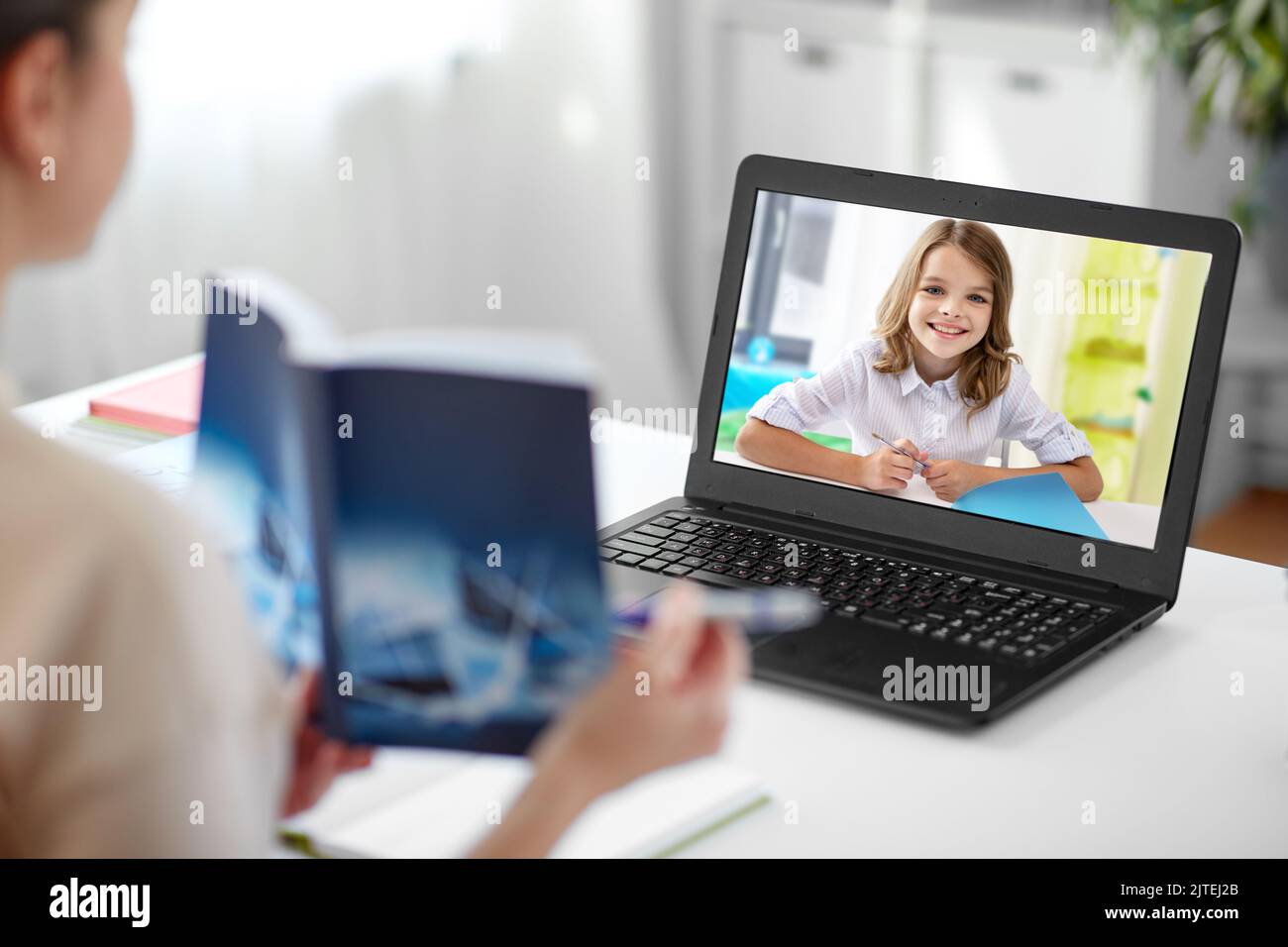 math teacher having online class at home Stock Photo - Alamy
