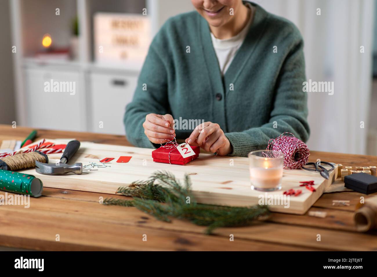 woman making advent calendar on christmas at home Stock Photo - Alamy