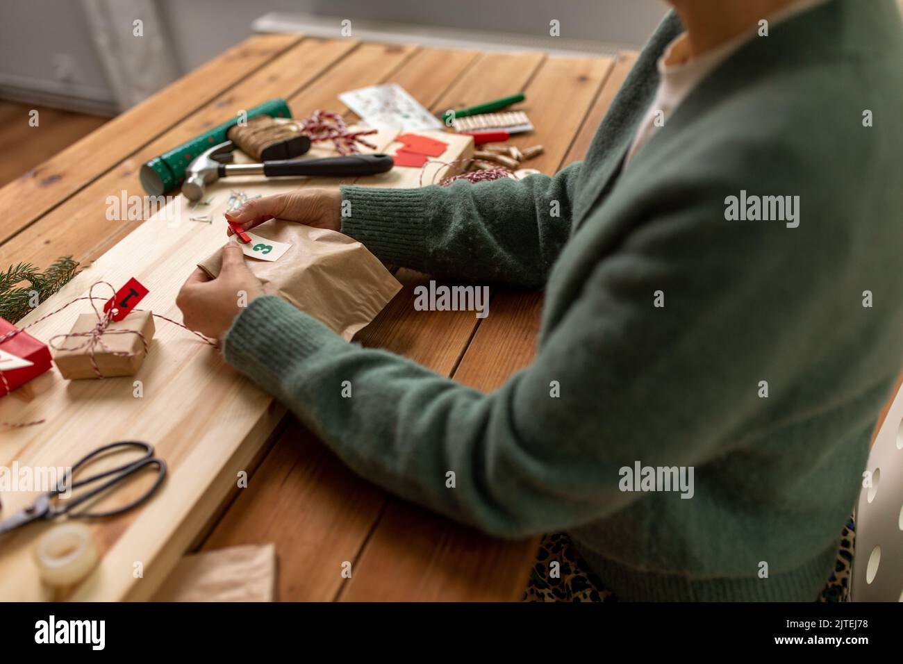 hands making christmas advent calendar at home Stock Photo - Alamy