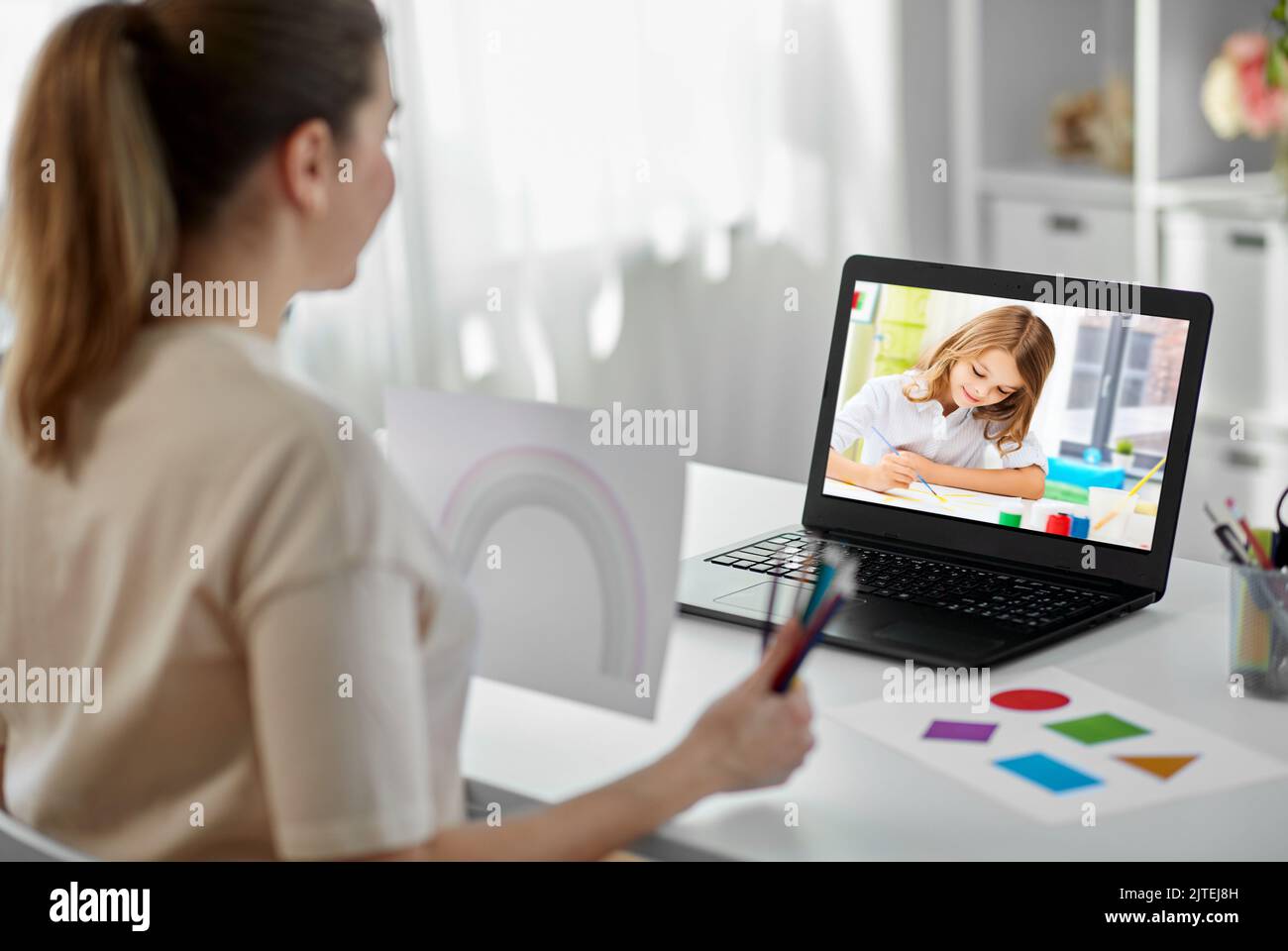 teacher having online class at home Stock Photo - Alamy