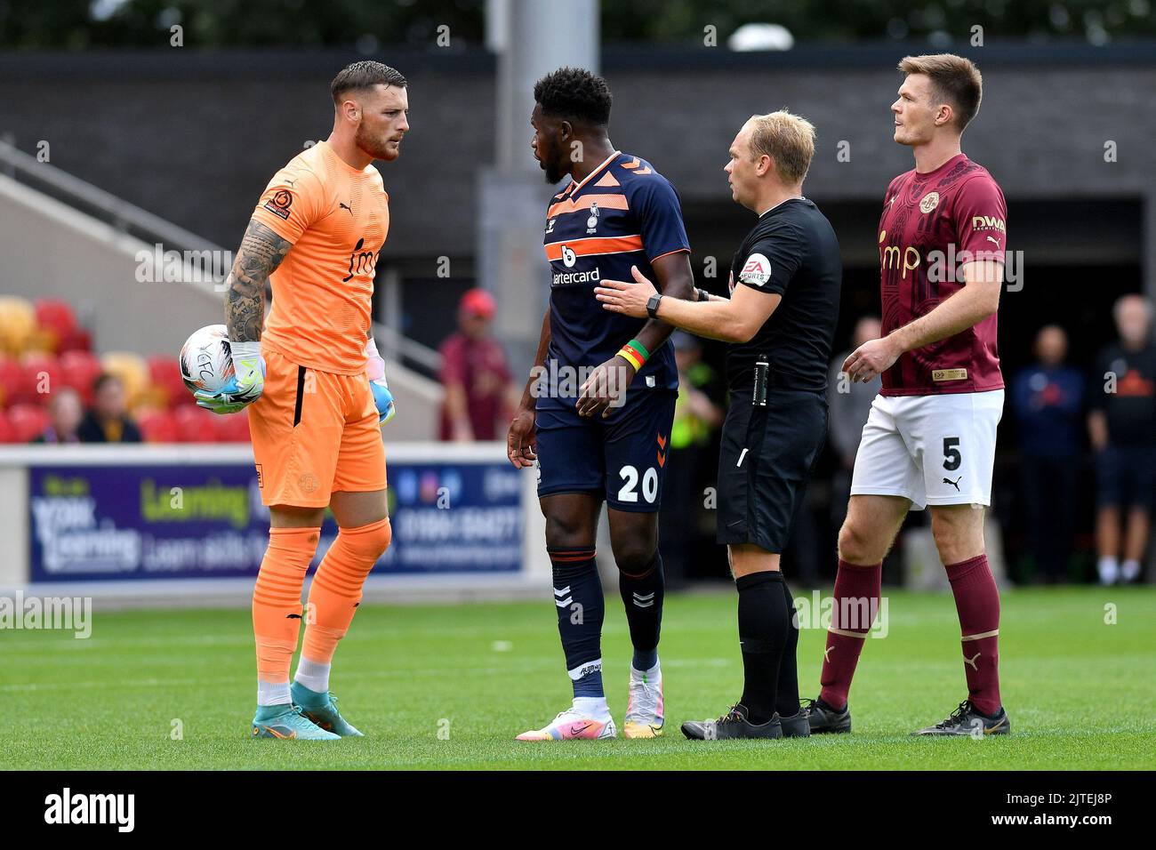 York, UK. 29th Aug, 2022. Mike Fondop-Talom of Oldham Athletic tussles ...