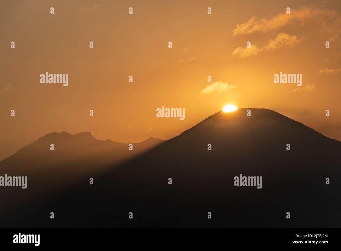 Sunrise over Mount Vesuvius, the famous volcano that overlooks the city ...