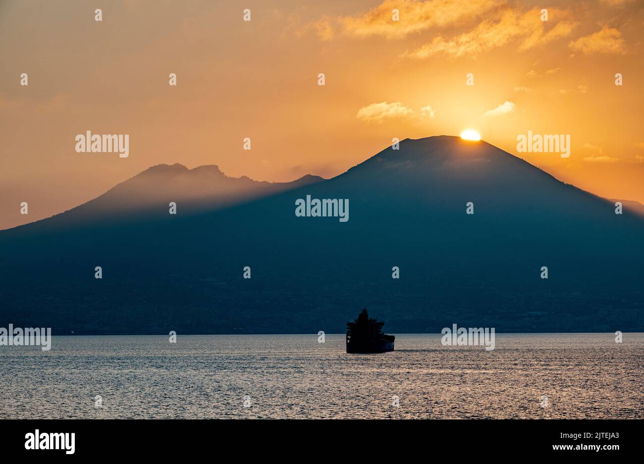 Sunrise over Mount Vesuvius, the famous volcano that overlooks the city ...