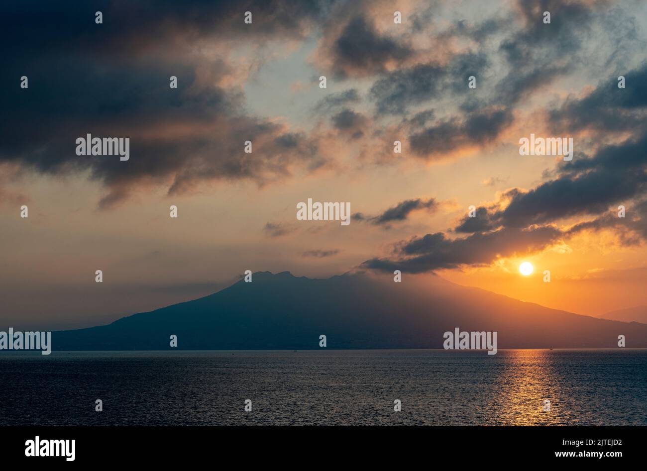 Sunrise over Mount Vesuvius, the famous volcano that overlooks the city ...