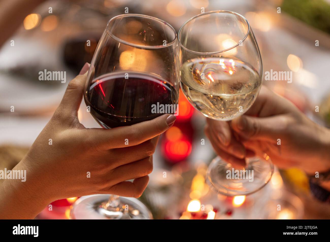 close up of hands toasting wine at christmas party Stock Photo - Alamy
