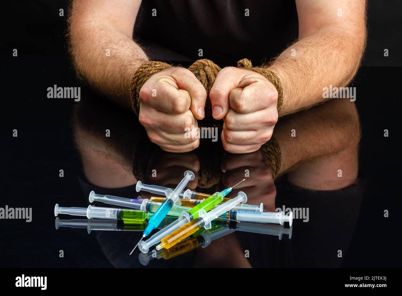 Drug addiction dependence and hostage concept. Bound male hands. Pile ...