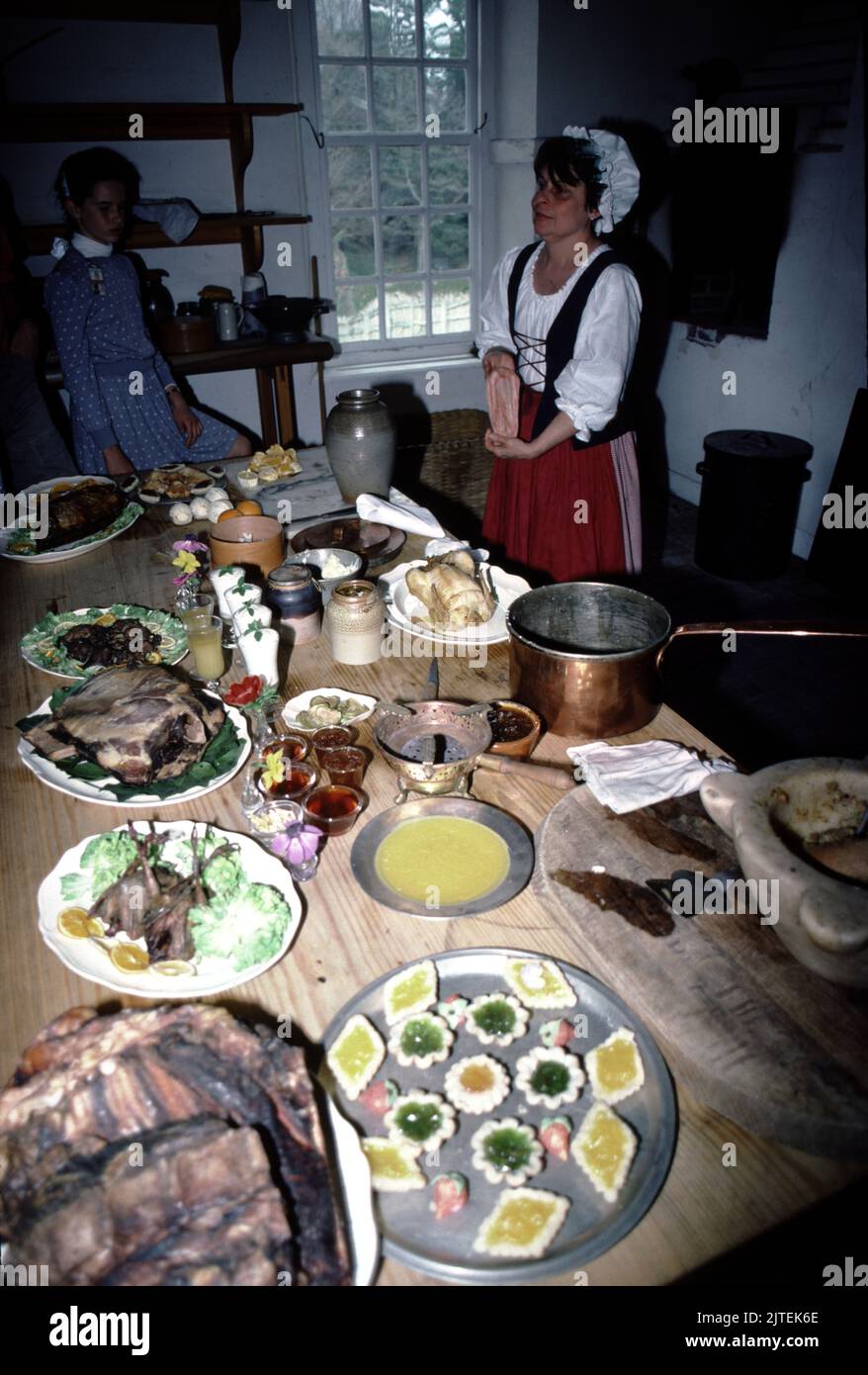 Williamsburg, VA. U.S.A. 9/1987. Gov. palace kitchen with docents ...