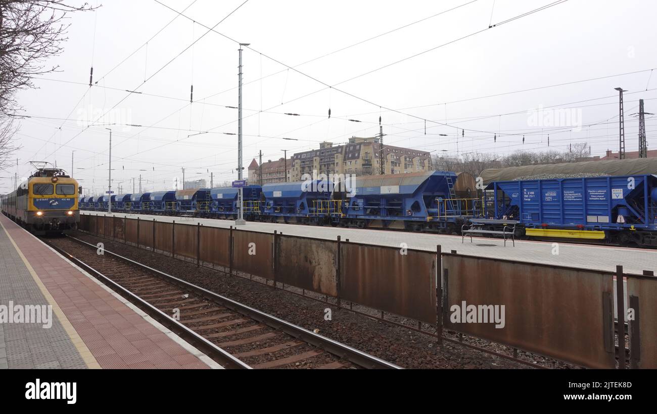 Train arriving at a trainstation Stock Photo - Alamy