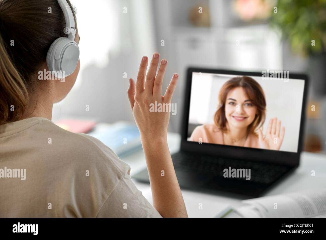 student with laptop having video call at home Stock Photo - Alamy