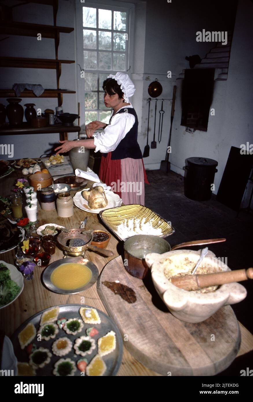 Williamsburg, VA. U.S.A. 9/1987. Gov. palace kitchen with docents ...