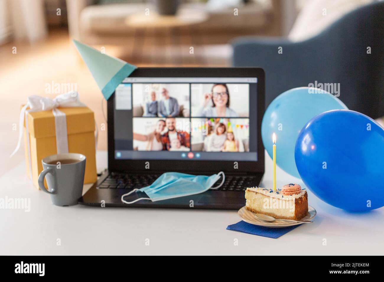 birthday cake and laptop with video call on screen Stock Photo - Alamy
