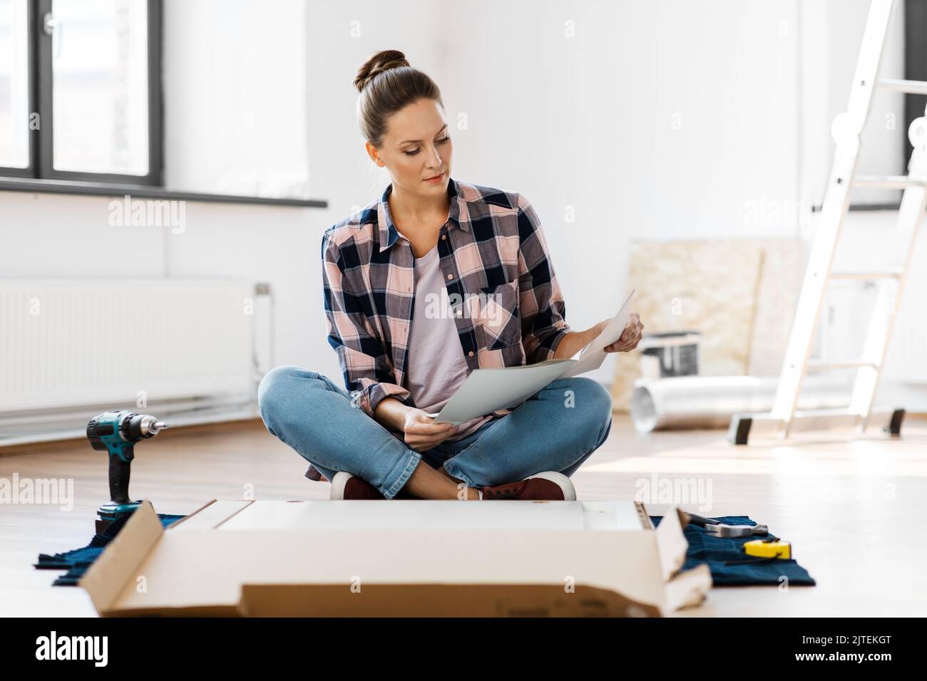 woman with manual assembling new furniture at home Stock Photo - Alamy