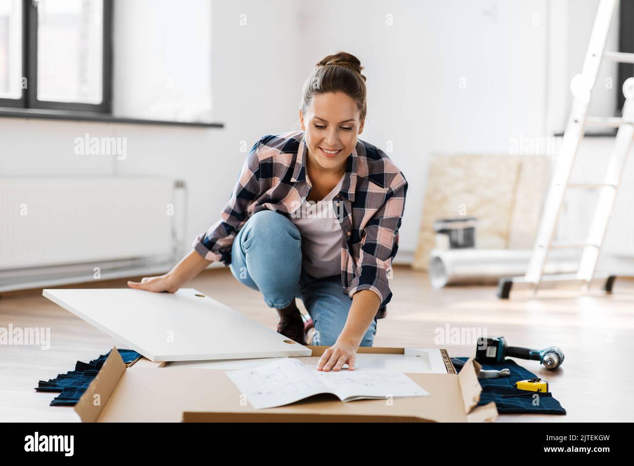 woman with manual assembling new furniture at home Stock Photo - Alamy